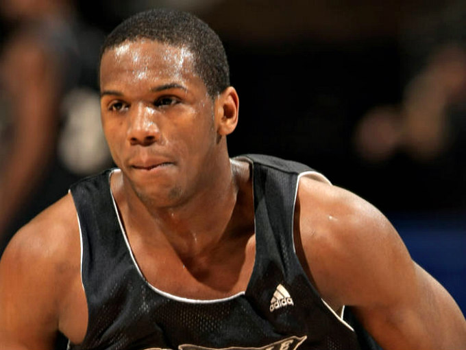 Dionte Christmas pens with Olimpico La Banda - Court Side Newspaper